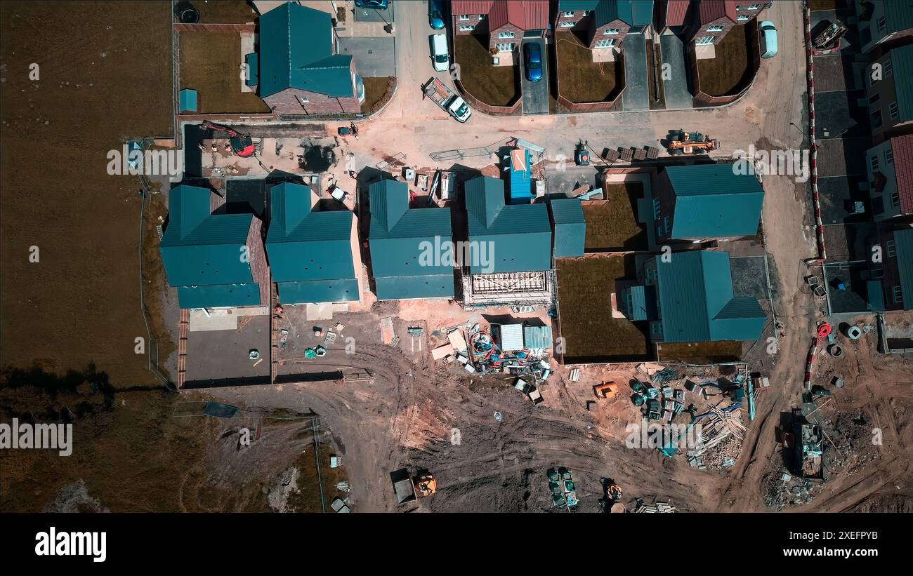 Aerial view of a residential construction site with multiple houses in ...