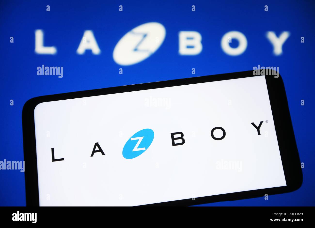 In this photo illustration, a La-Z-Boy Inc logo is seen on a smartphone ...