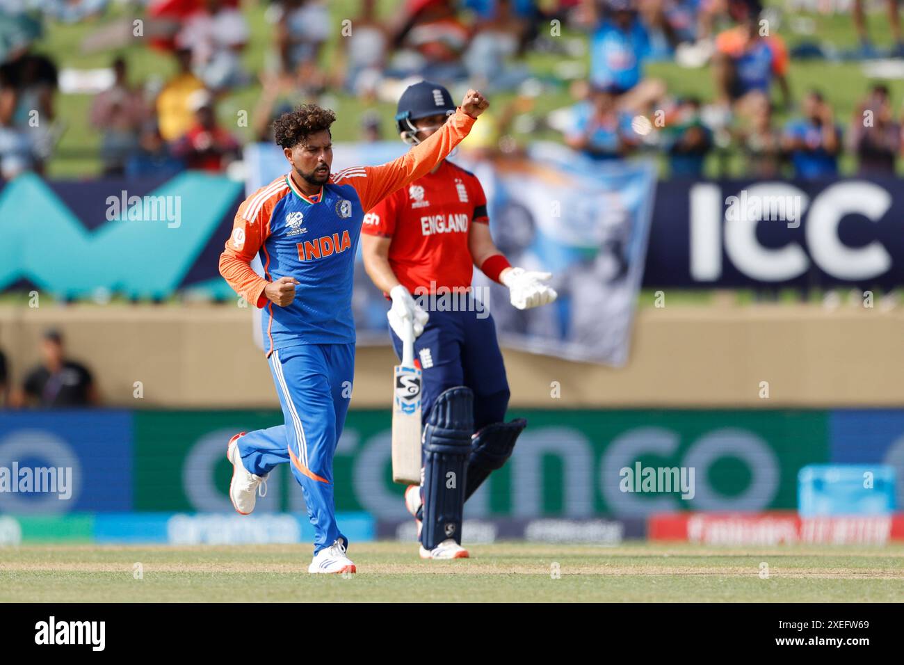 India's Kuldeep Yadav celebrates after taking the wicket of England's ...