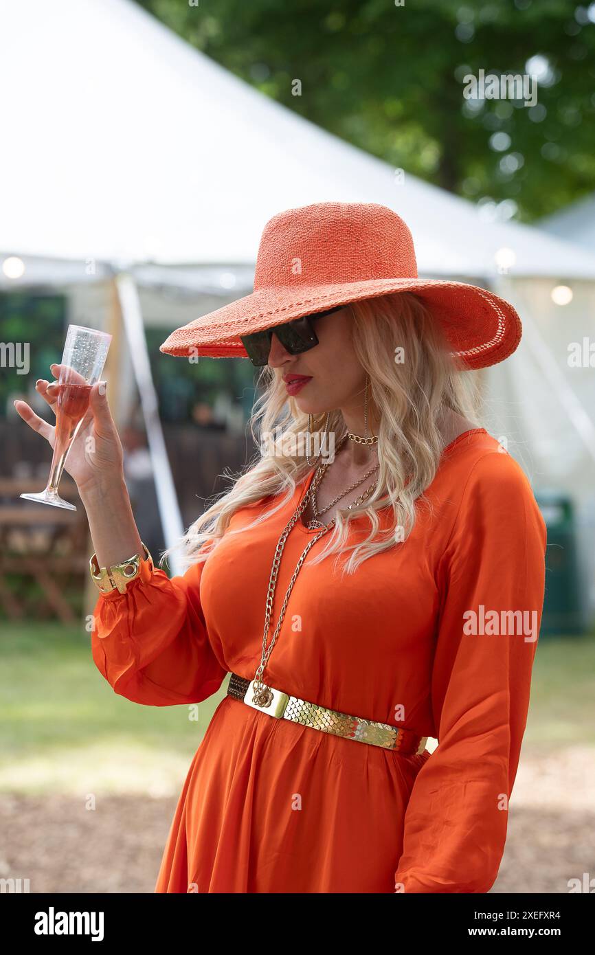 Stoke Poges, UK. 27th June, 2024. Iren Nikard wears a pretty orange ...
