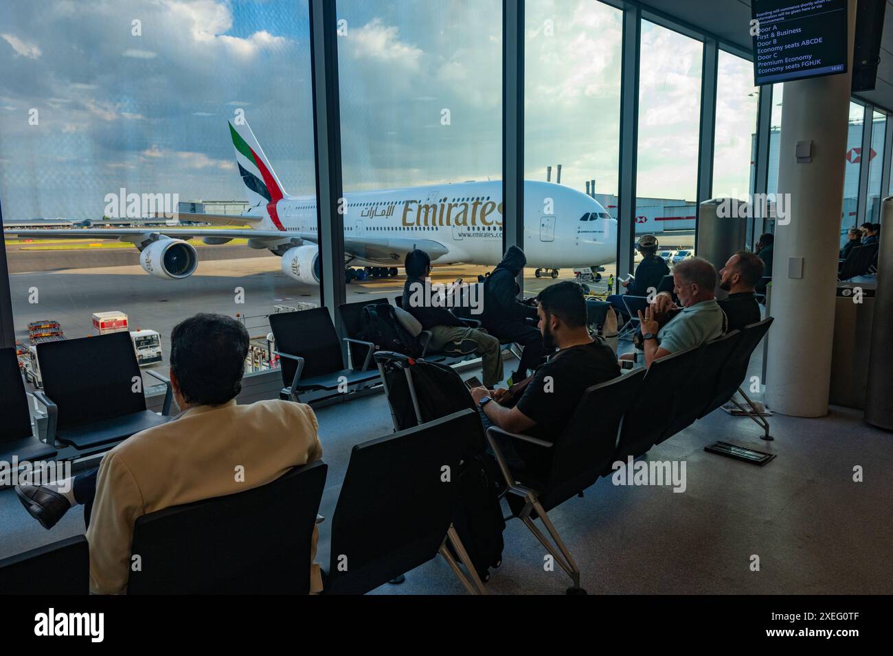 Passengers waiting in terminal to board on Emirates Airbus A380-800 at ...