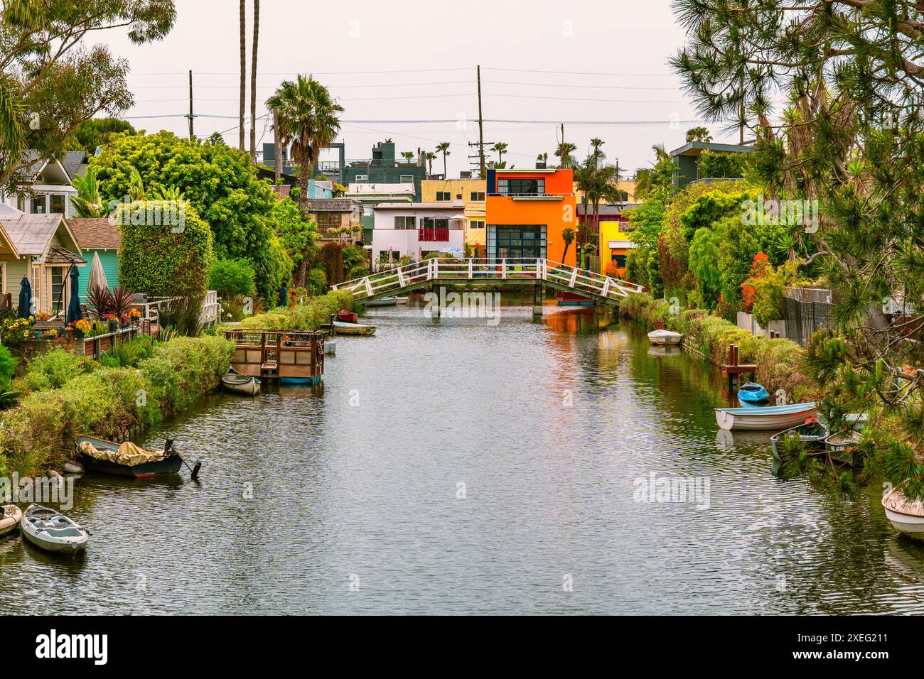 Picturesque and quaint canals lined by palm trees and colorful homes in ...