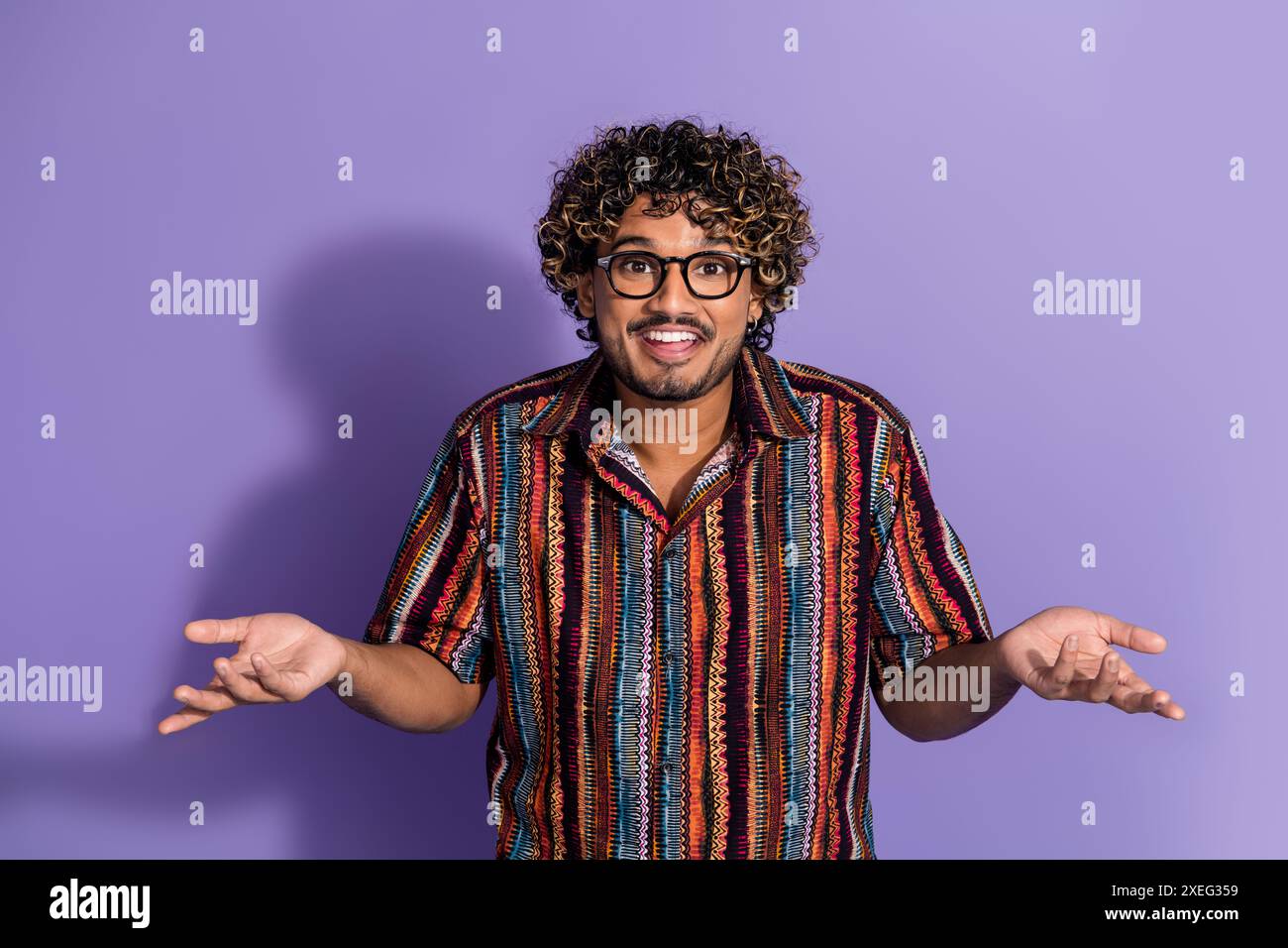 Photo of clueless man with wavy hairdo dressed print shirt in glasses ...