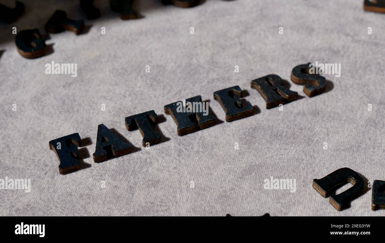 Lettering father in black letters on grey background on father's day ...