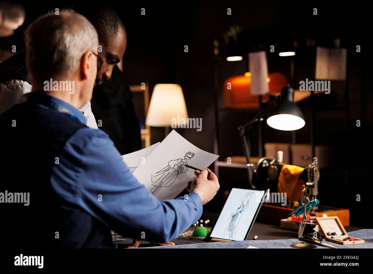 Stylish fashion designers drawing fashionable chic dress sketches ...