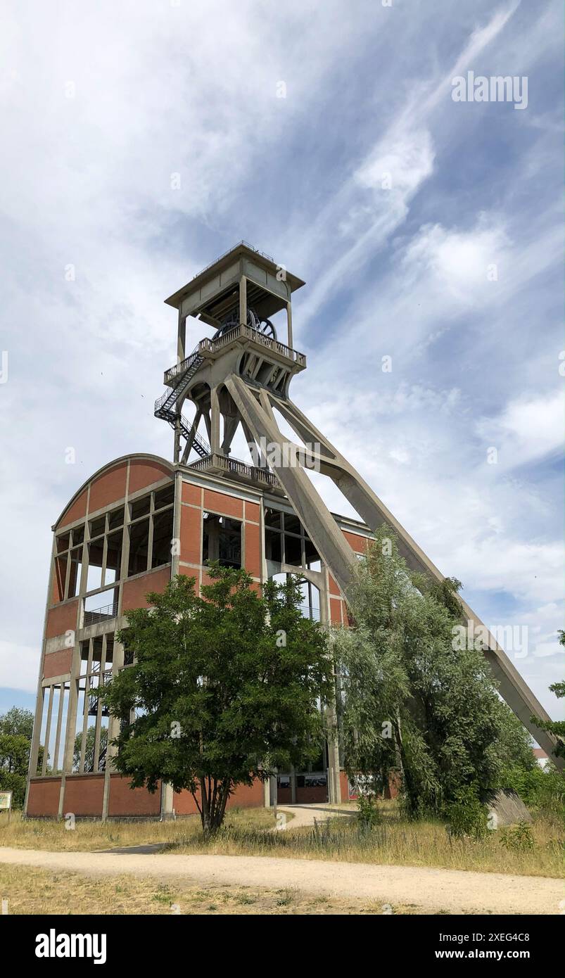 Industrial Heritage: Historic Mine Shaft Tower Against a Cloudy Sky ...