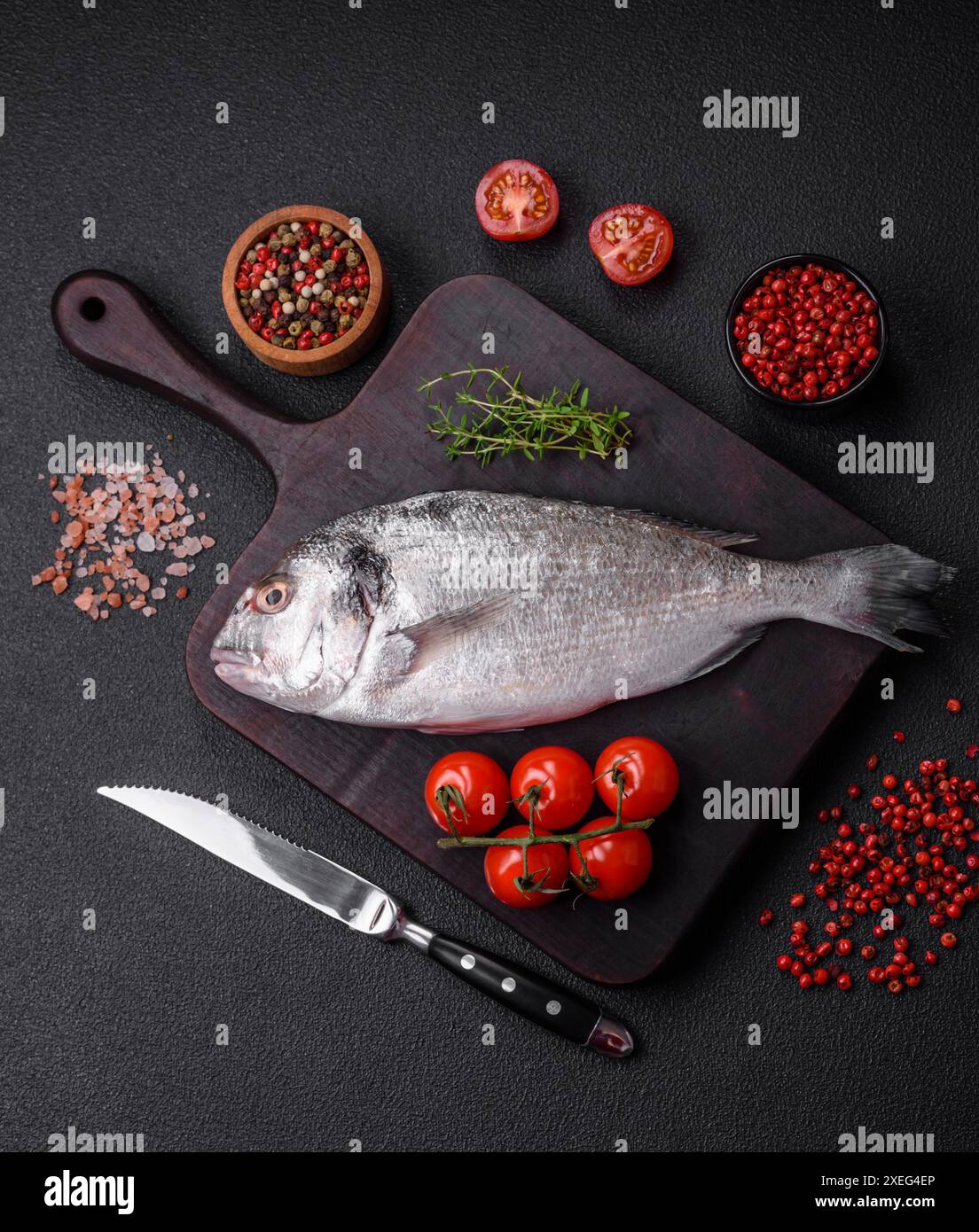 Fresh raw dorada fish with salt Stock Photo - Alamy