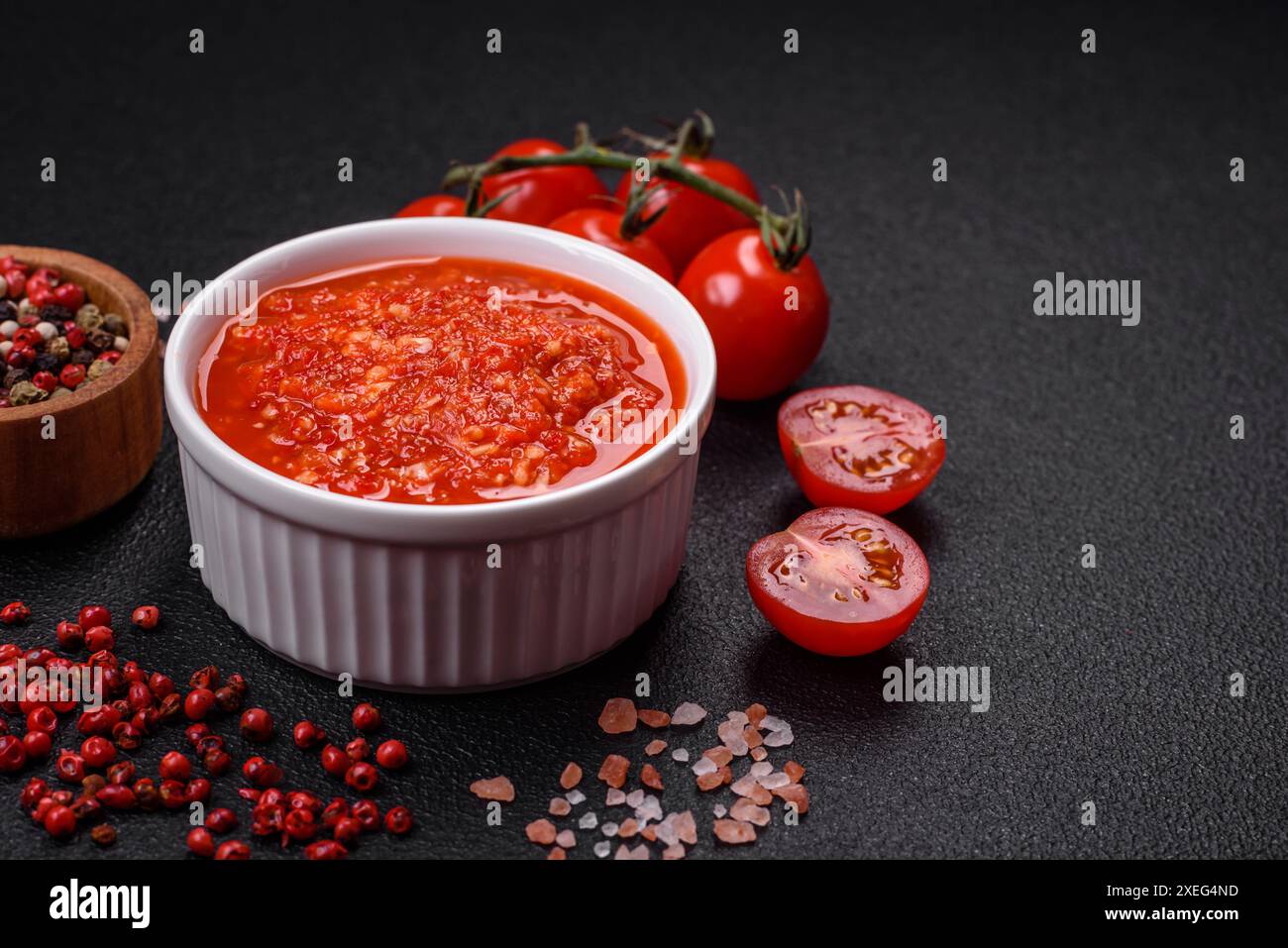 Delicious hot spicy red sauce with salt and spices in a ceramic bowl ...