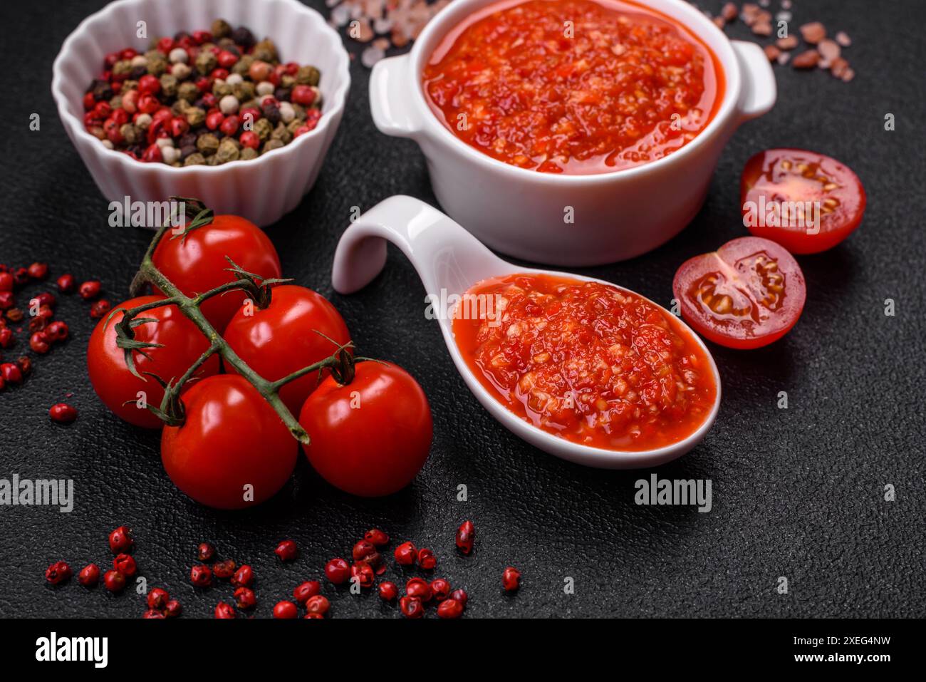 Delicious hot spicy red sauce with salt and spices in a ceramic bowl ...