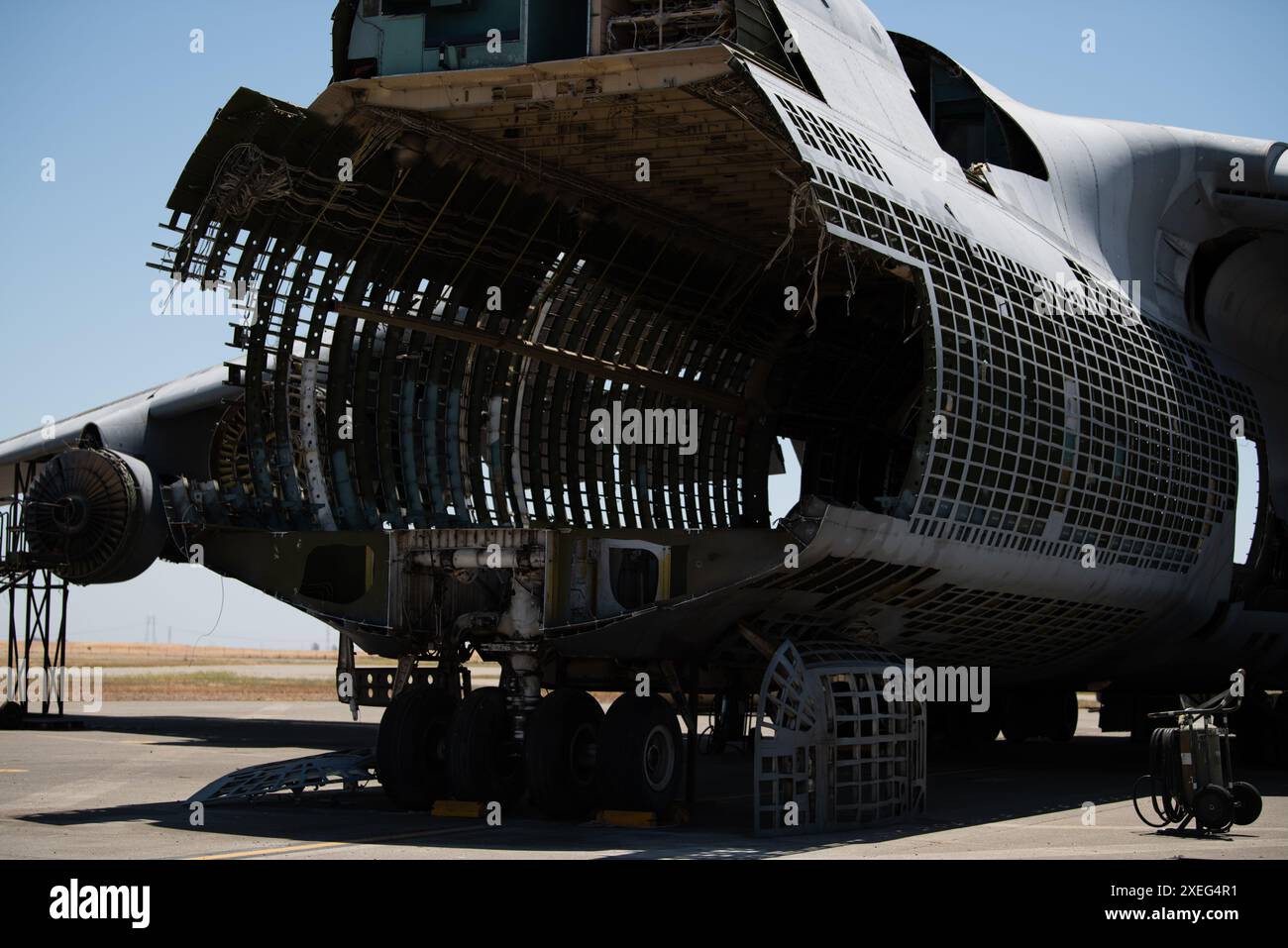 A U.S. Air Force C-5A Galaxy is disassembled on the eastern side of the ...