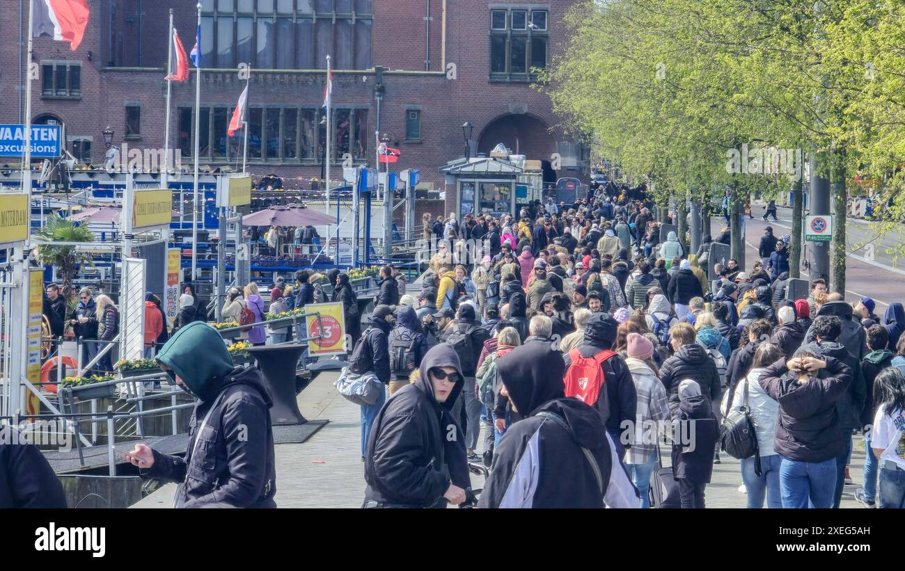 A vibrant scene unfolds as a large group of diverse individuals ...