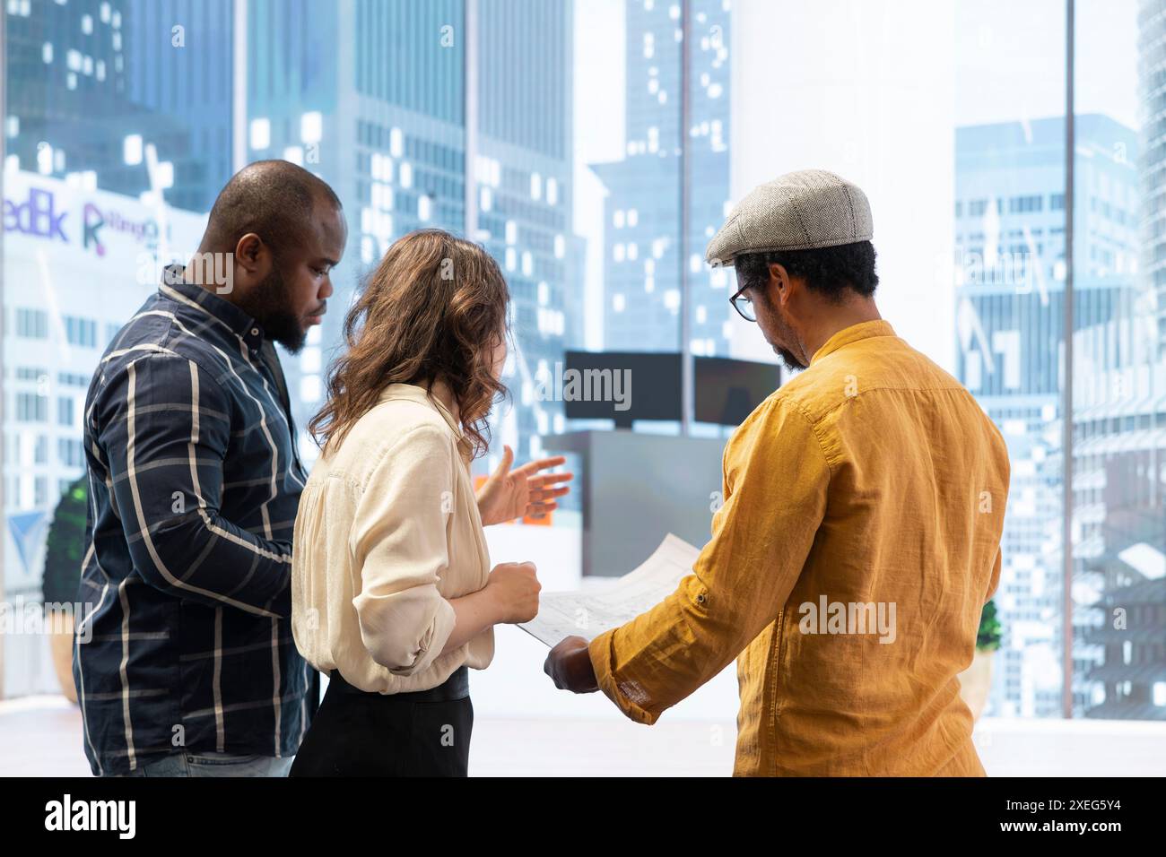 Business team and a real estate agent strategizing the relocation of a ...