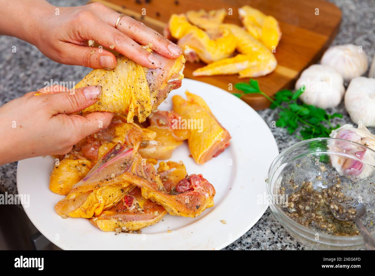 Womens hands mix chicken pieces hi-res stock photography and images - Alamy