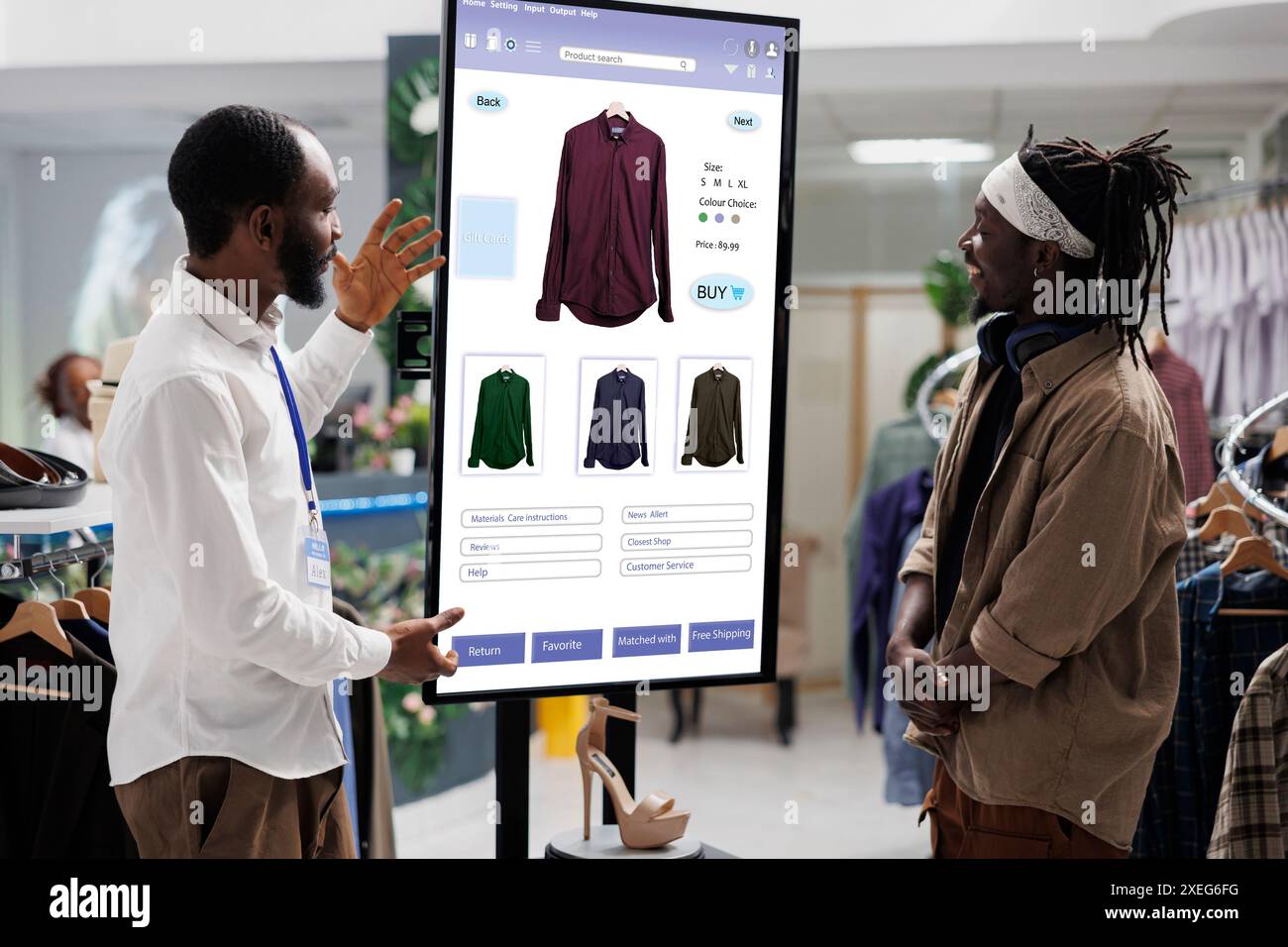 People look at clothing kiosk service with interactive board in fashion ...