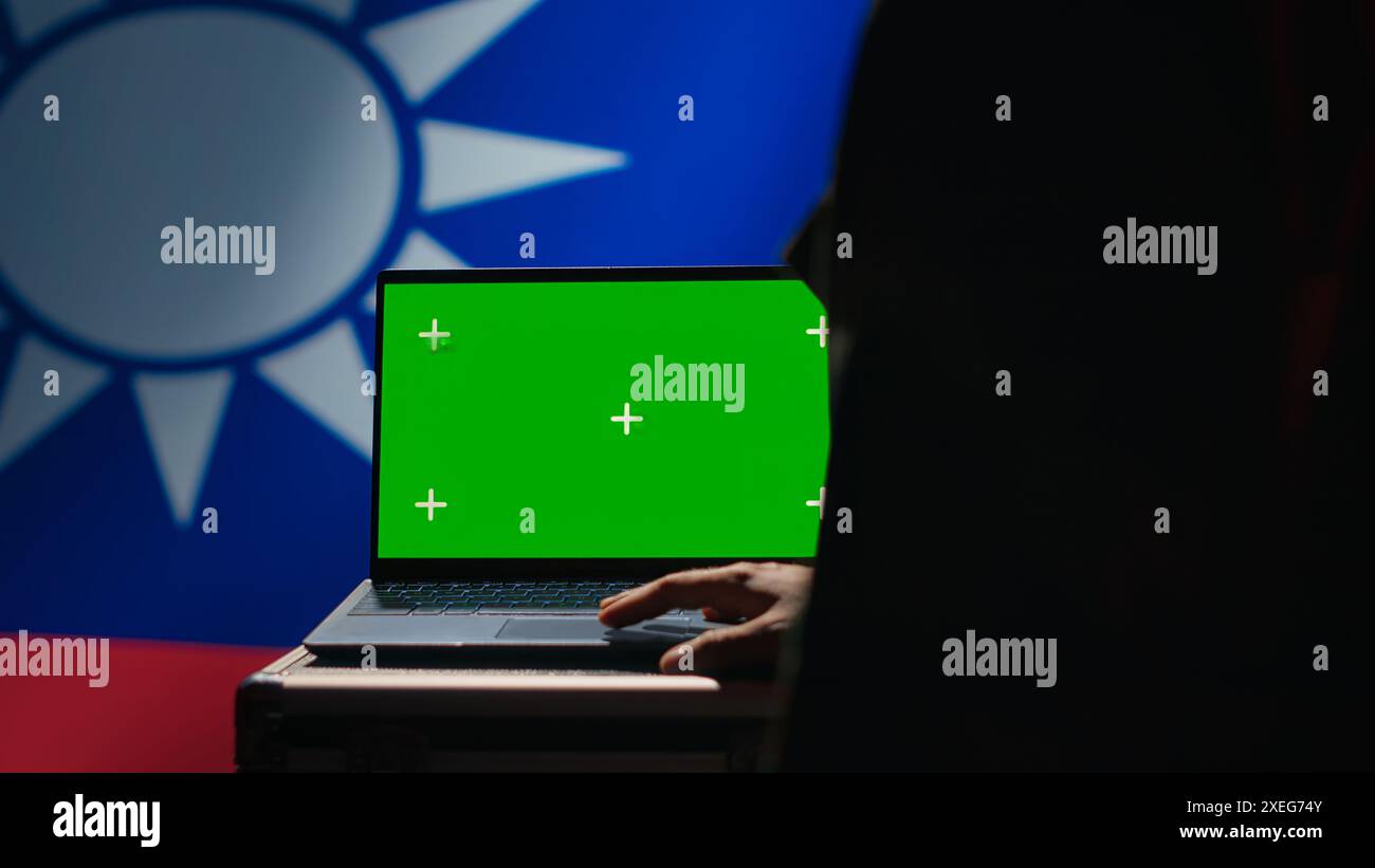 Taiwanese insurgent using military tech on green screen laptop to ...