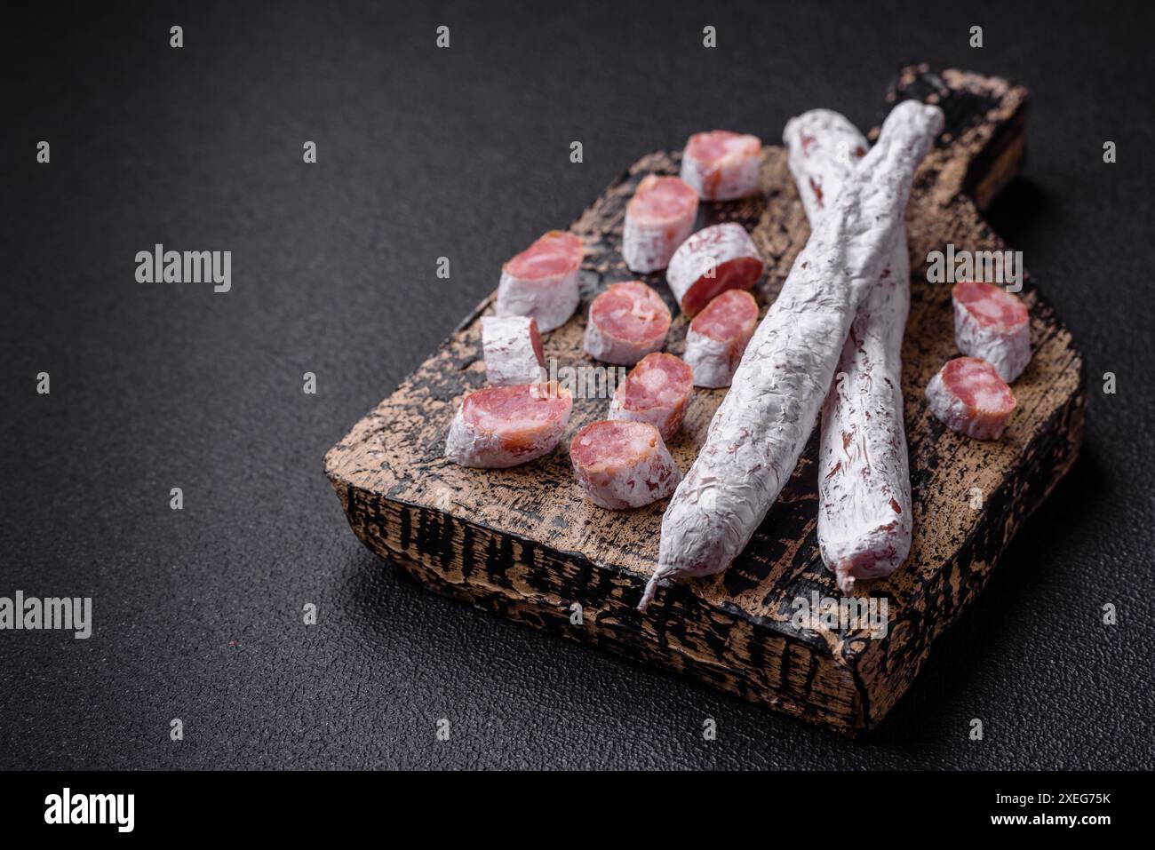 Delicious Spanish smoked sausage fuet with salt and spices Stock Photo ...