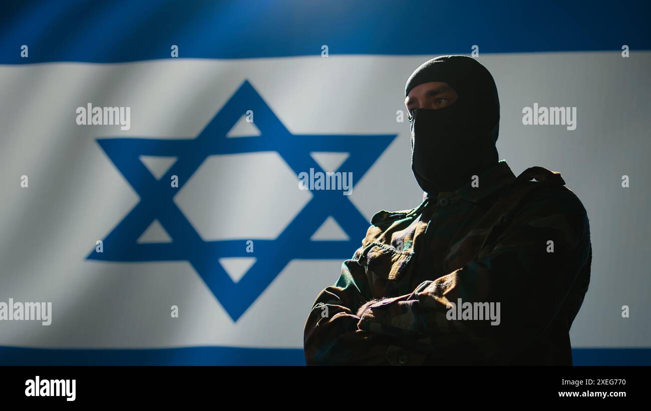 Mossad intelligence corps agent standing proud in front of Israel flag ...