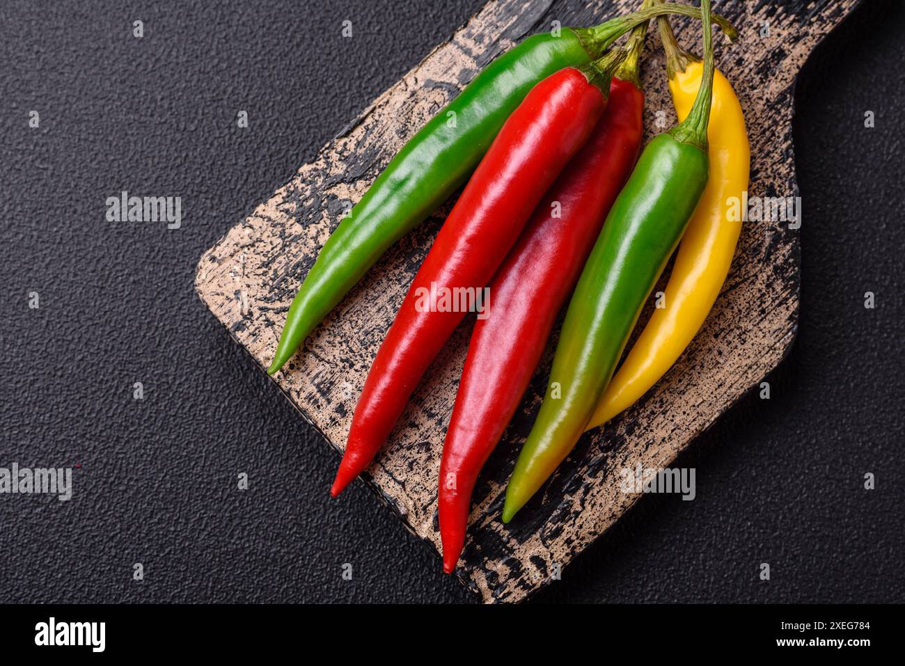 Hot chili peppers of three different colors red, green and yellow Stock ...