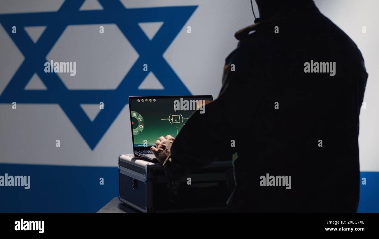 Israel Defense Forces dispatcher looking at surveillance transmission ...