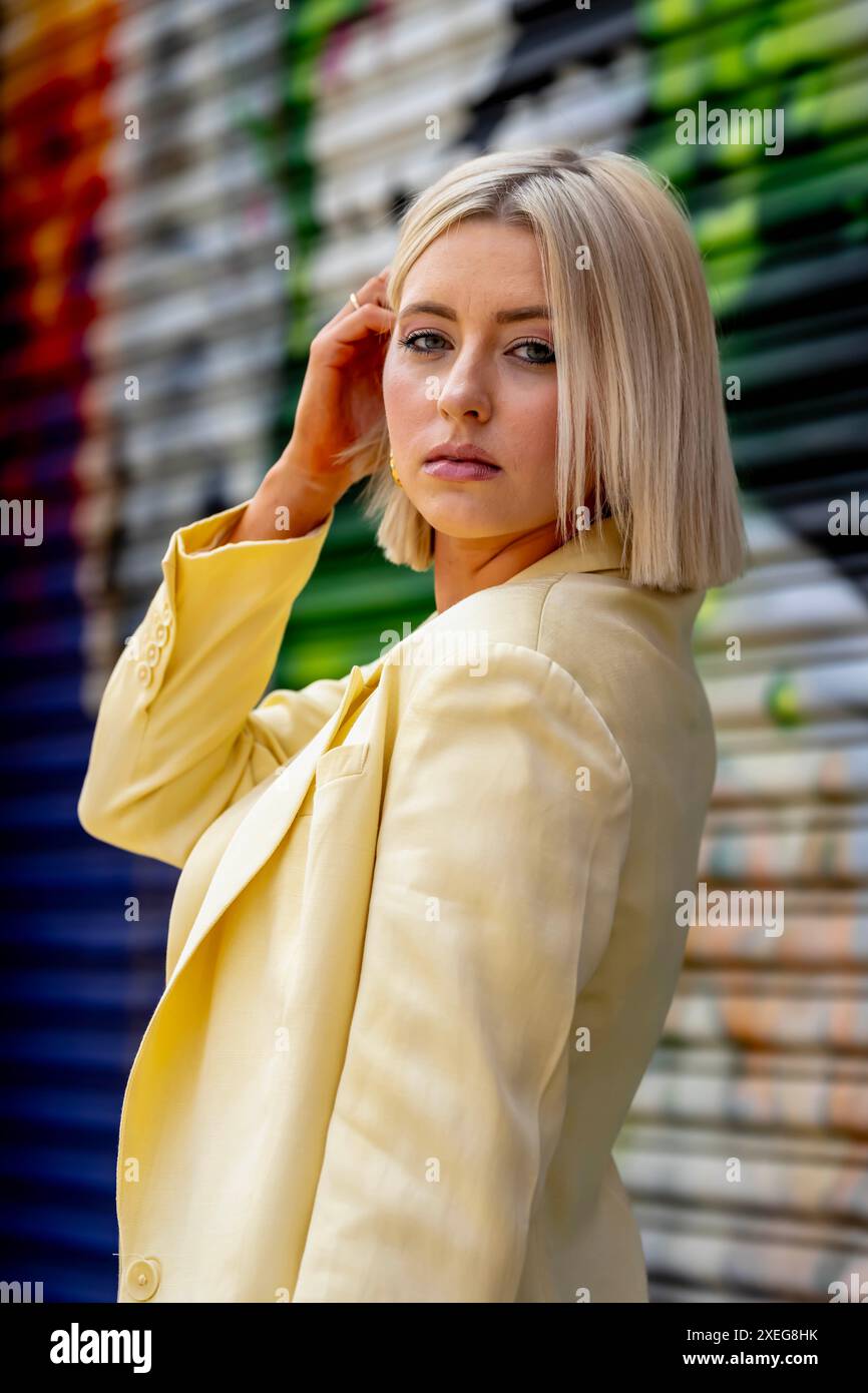 A Lovely Blonde Model Poses Outdoor While Enjoying The Spring Weather ...