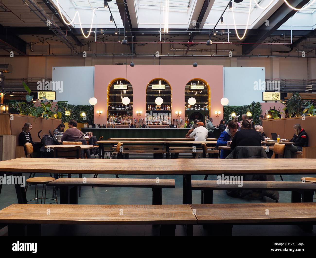 People eating lunch in the food hall inside the Market Building. in ...