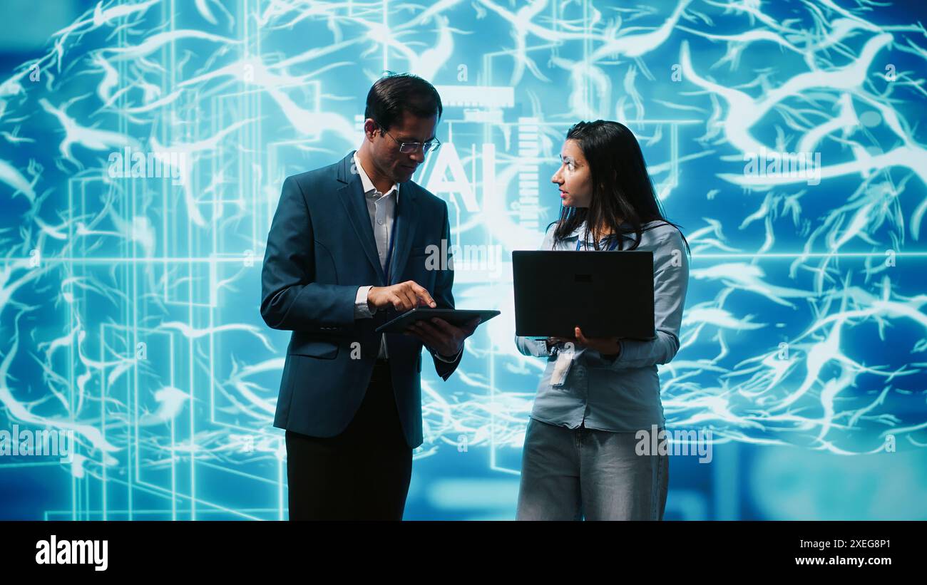 Teamworking colleagues using AI neural networks modeled after human ...