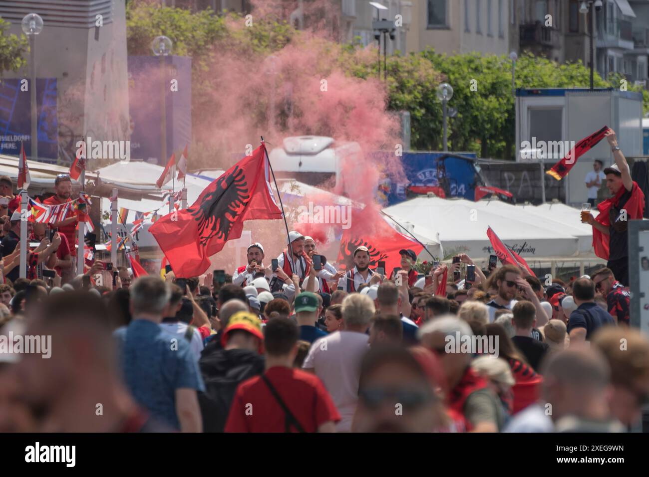 Albanian football fans celebrate by waving flags and using red smoke ...