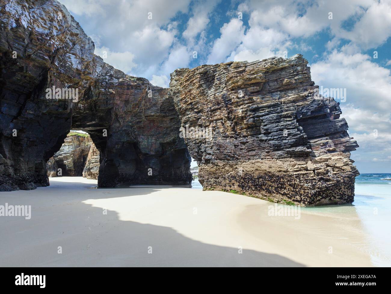 Natural arches on beach Stock Photo - Alamy