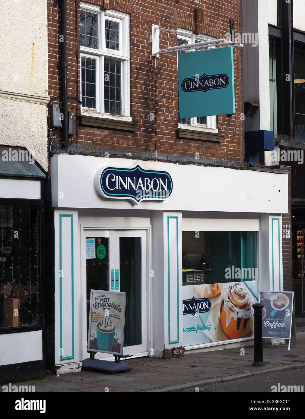 Sign outside the front of a Cinnabon Bakery shop in Cheste Stock Photo ...