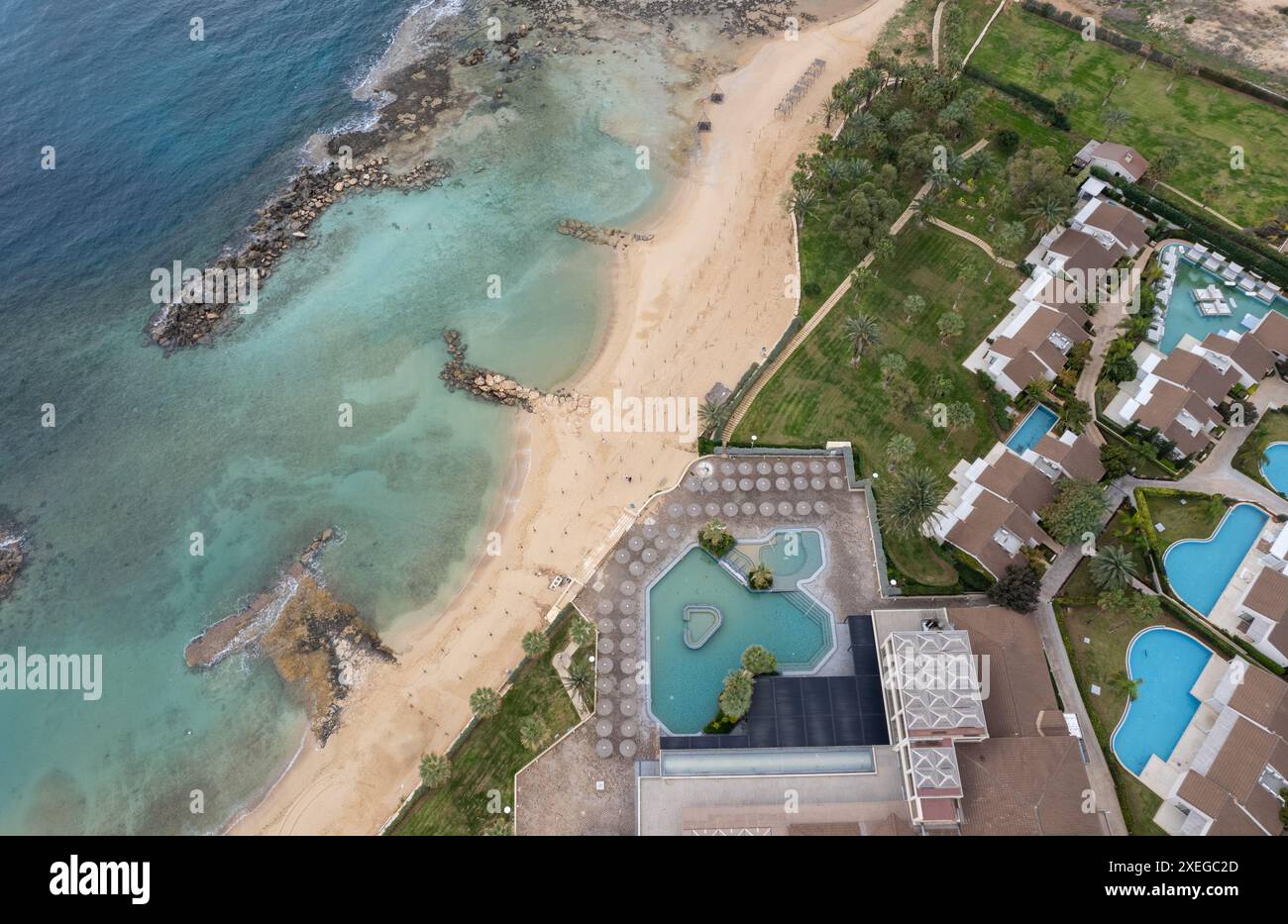 Drone aerial of luxury holiday hotel resort and sandy tropical beach in ...