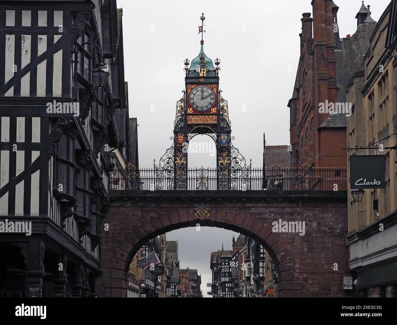 The Eastgate clock and clock in Chester city walls surrounded by the ...
