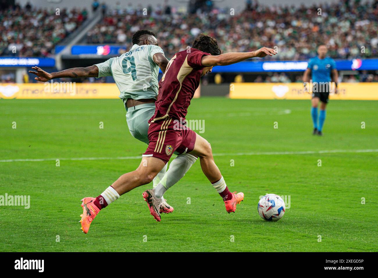 Mexico forward Julian Quiñones (9) fouls Venezuela defender Jon Mikel ...