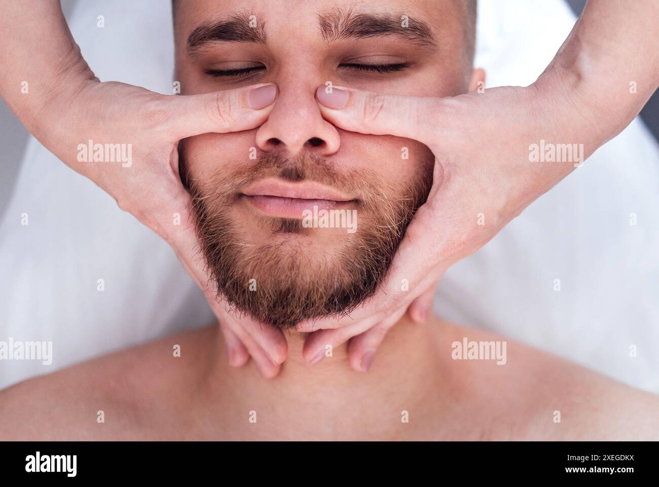 Massage chin face young woman hi-res stock photography and images - Alamy