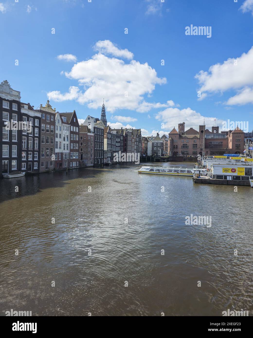 A picturesque scene of a river flowing gracefully through a bustling ...