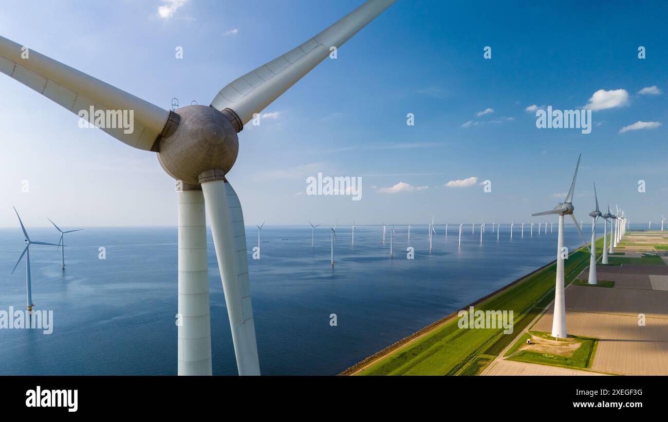 Aerial view of windmill turbines spinning gracefully in a wind farm ...