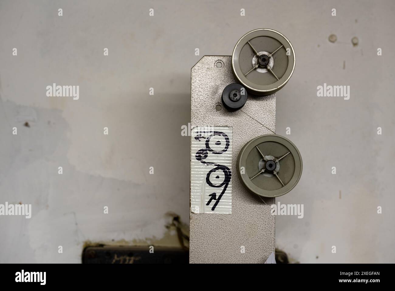 Projection room of the Bambi cinema with projector and film reels Stock ...