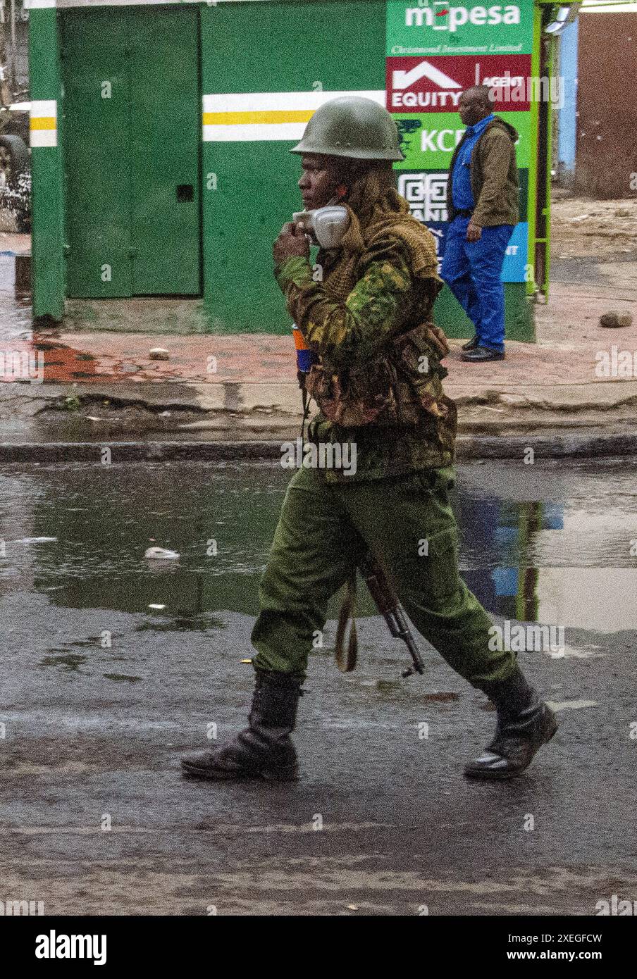 Nairobi, Kenya. 27th June, 2024. Riot police patrol the streets during ...