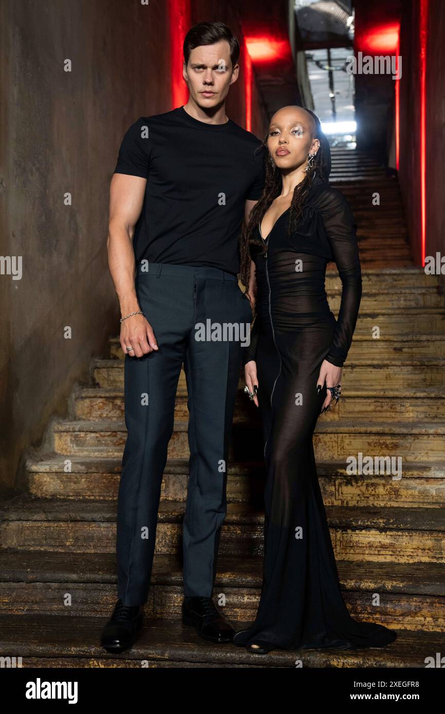 Bill Skarsgard, left, and FKA Twigs pose for photographers upon arrival ...