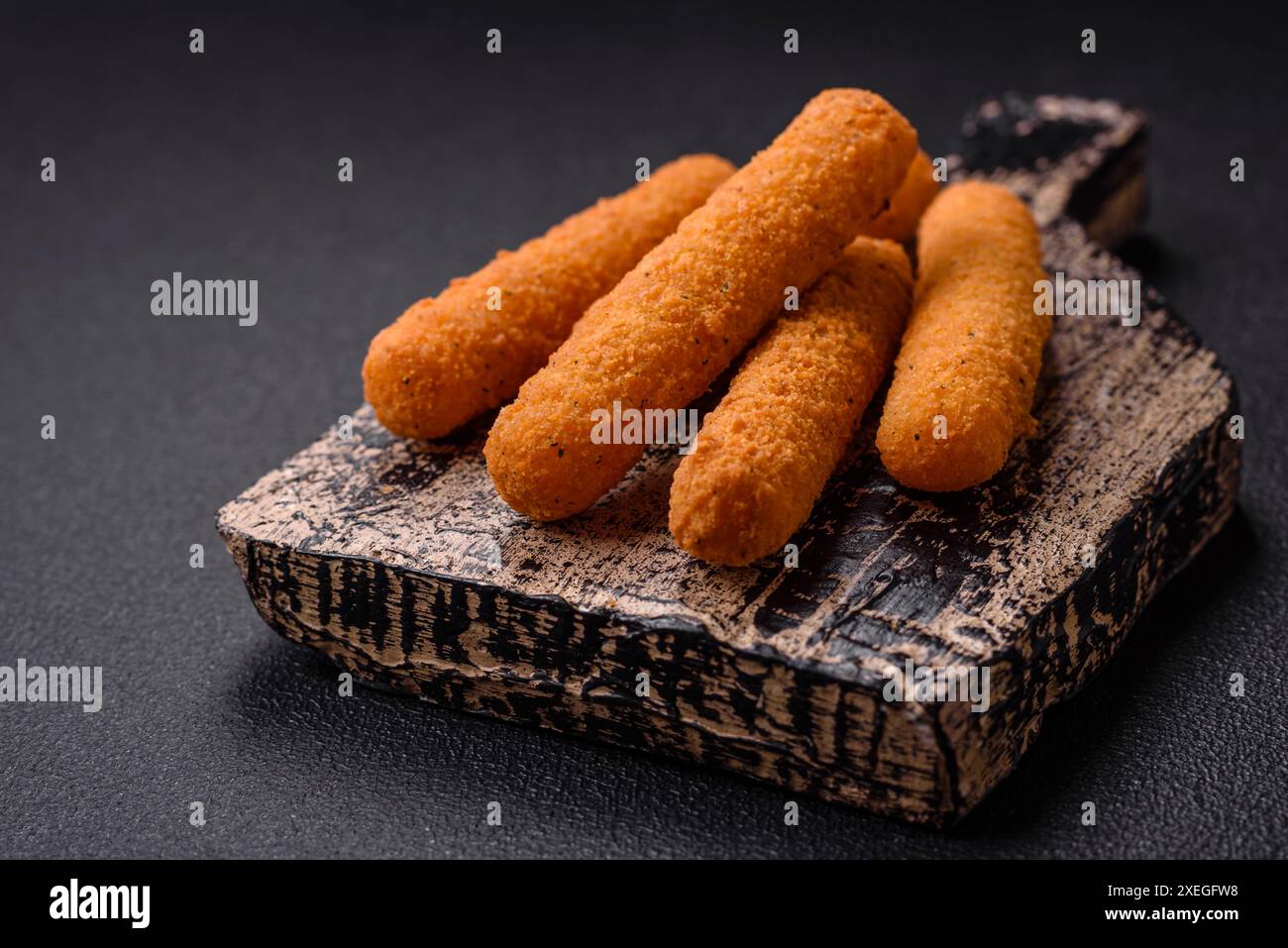 Delicious crispy cheese sticks with mozzarella, salt and spices ...