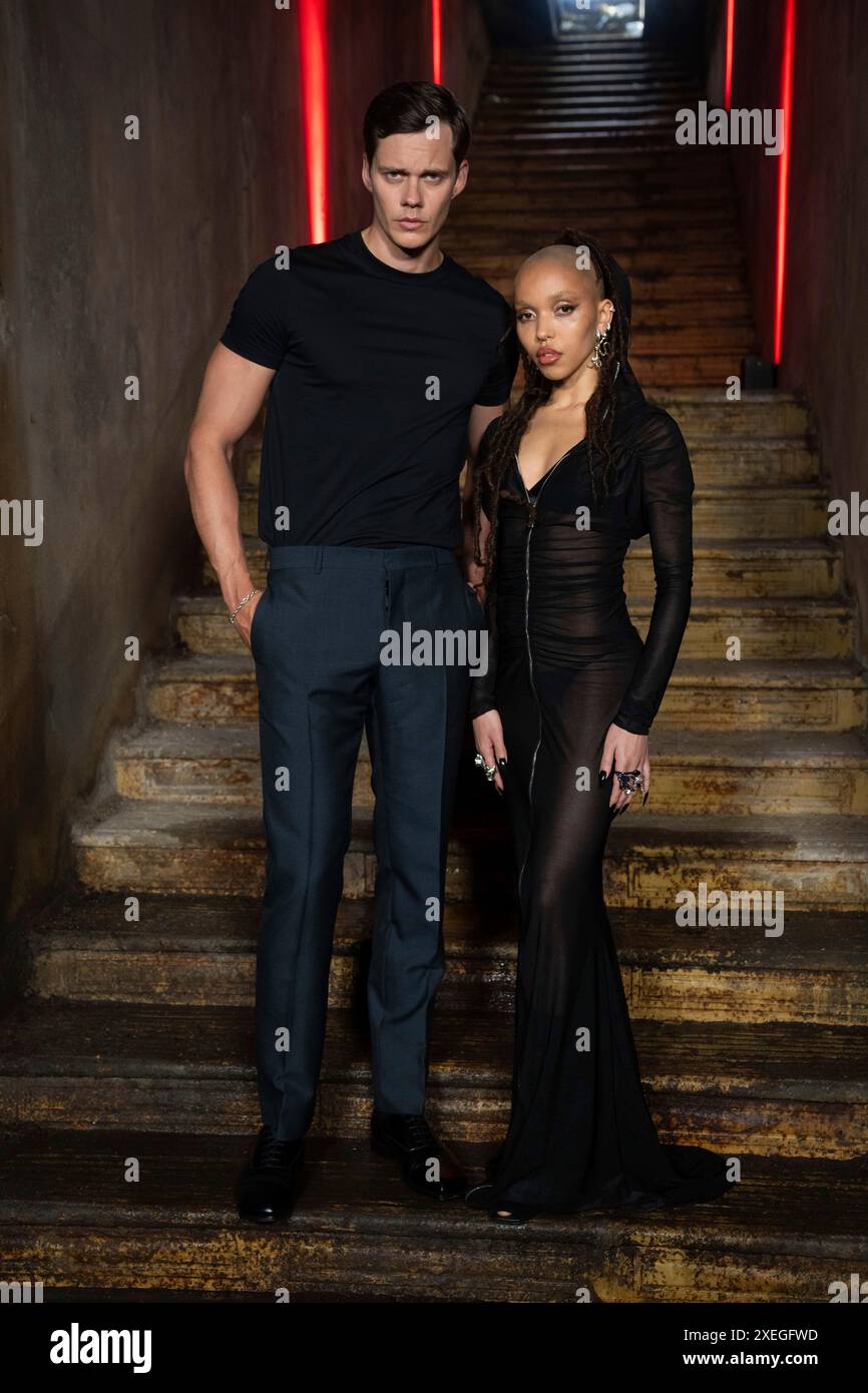 Bill Skarsgard, left, and FKA Twigs pose for photographers upon arrival ...