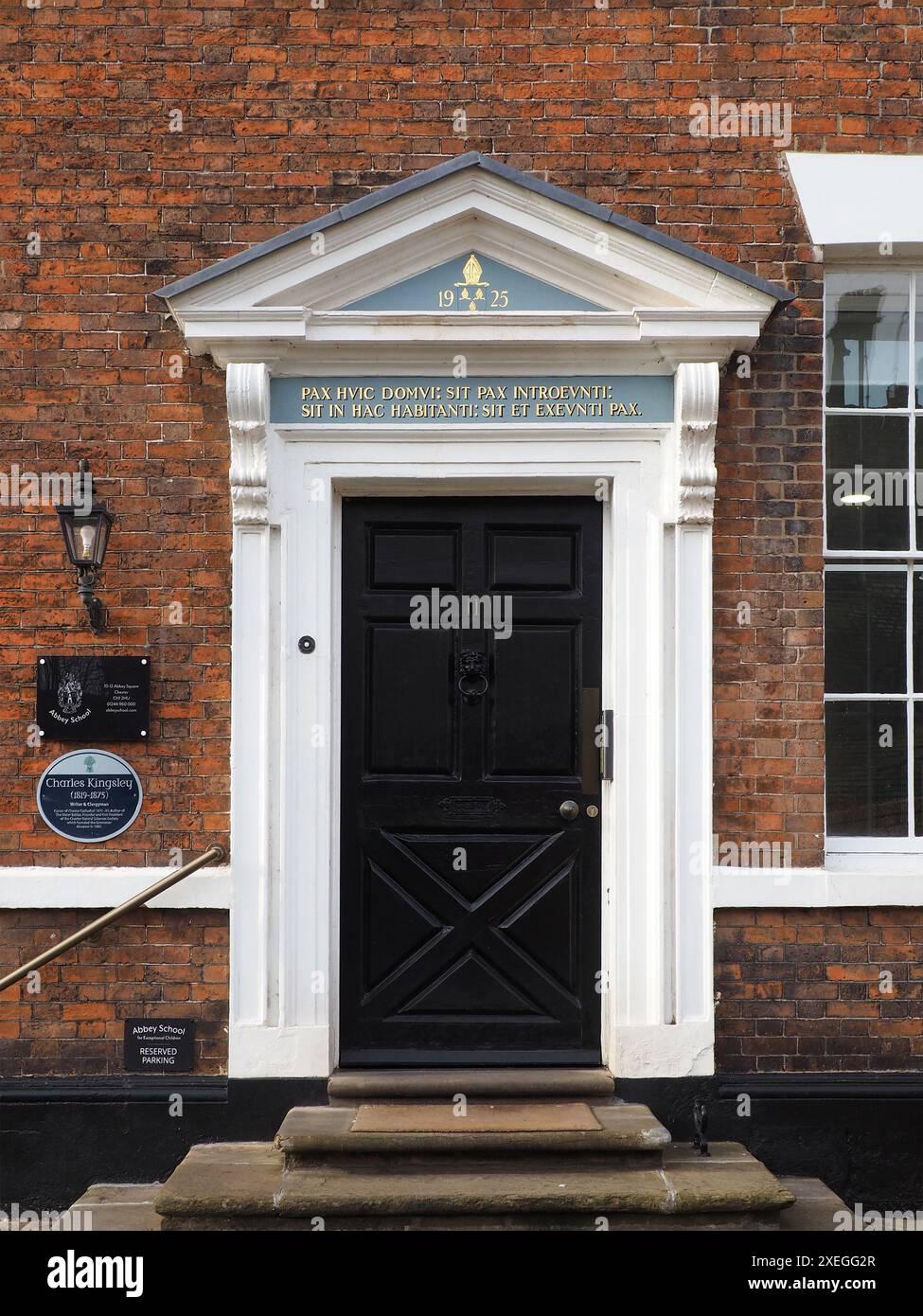 The doorway of Chester Abbey School woth a blue plaque commemorating ...