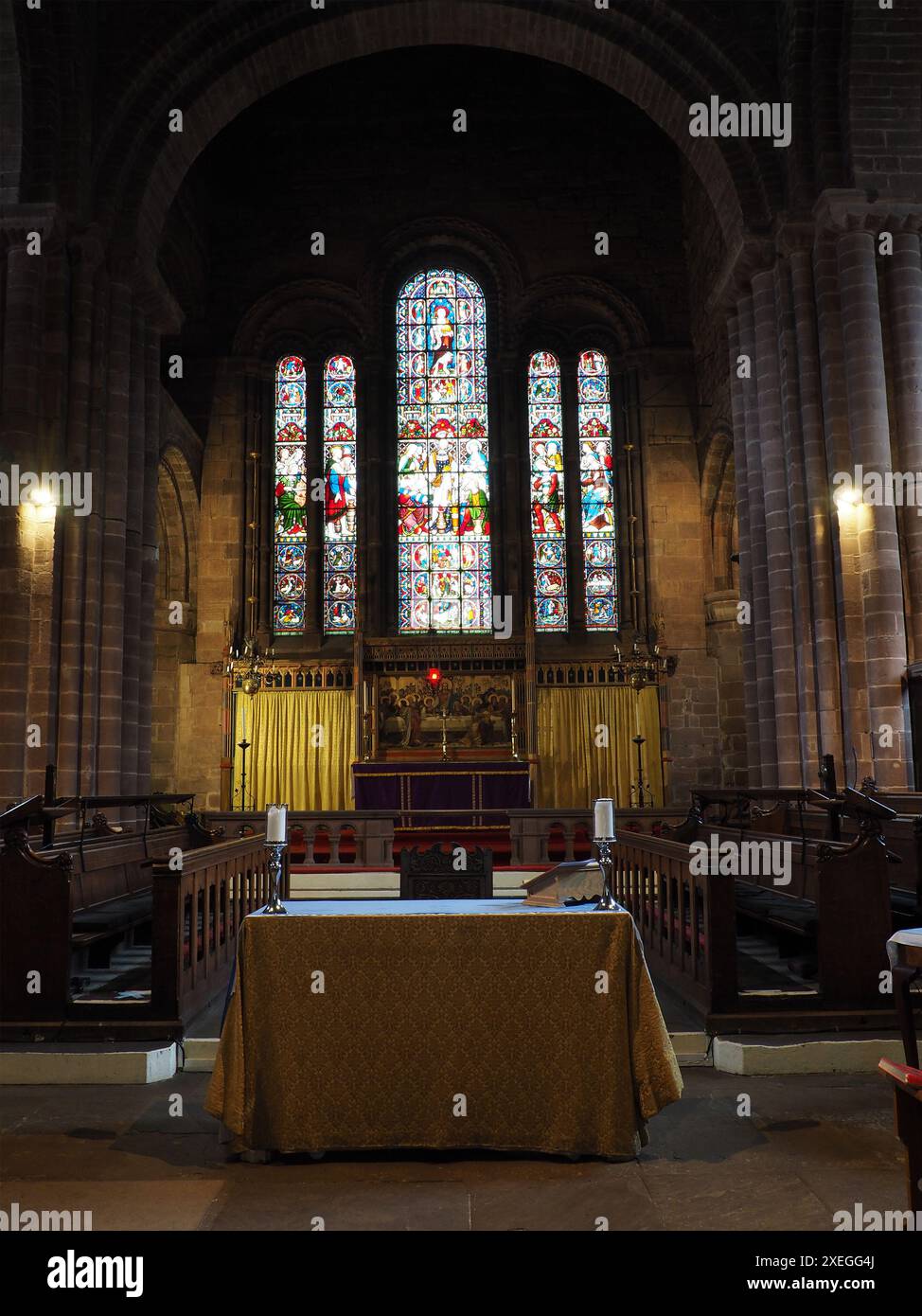 The alter and stained glass windows in St John the Baptist's Church ...