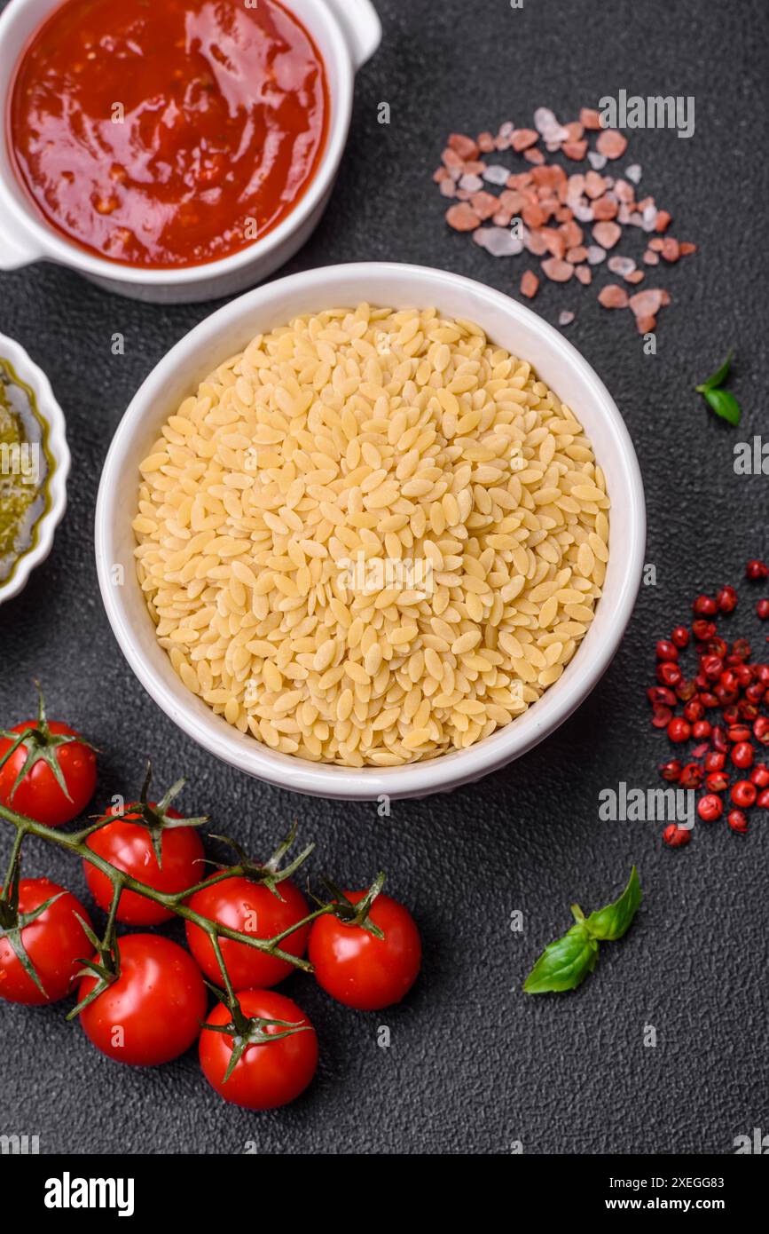 Raw whole grain orzo pasta as an ingredient for a delicious dish Stock ...