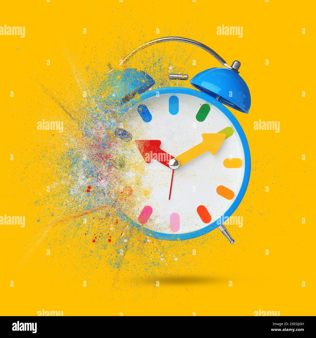 Bright alarm clock dissolving on orange background. Flow of time Stock ...