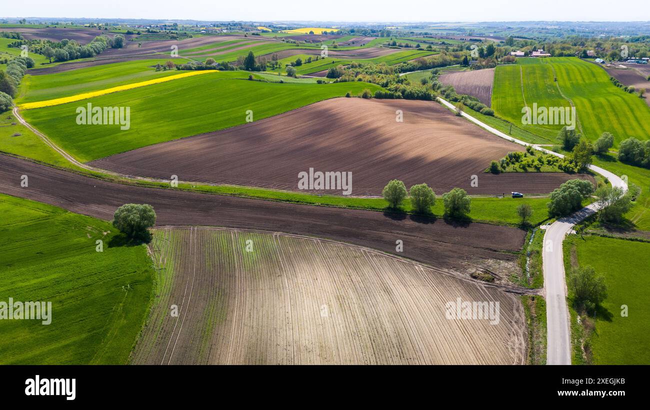 Curvy countryside road in Ponidzie region of Poland. Aerial drone view ...