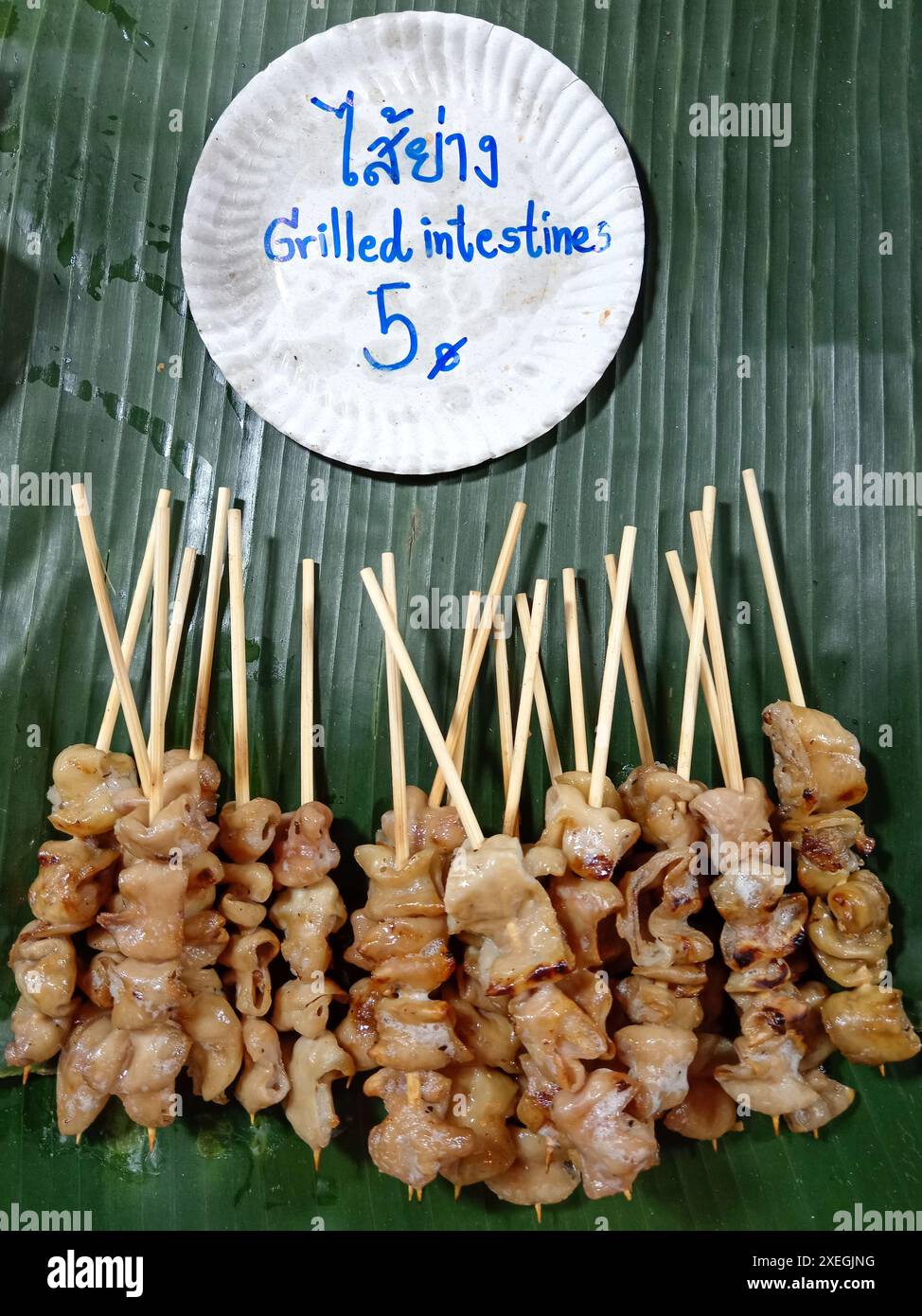 Fresh cooked grilled pork intestines or sai moo yang at a street food ...