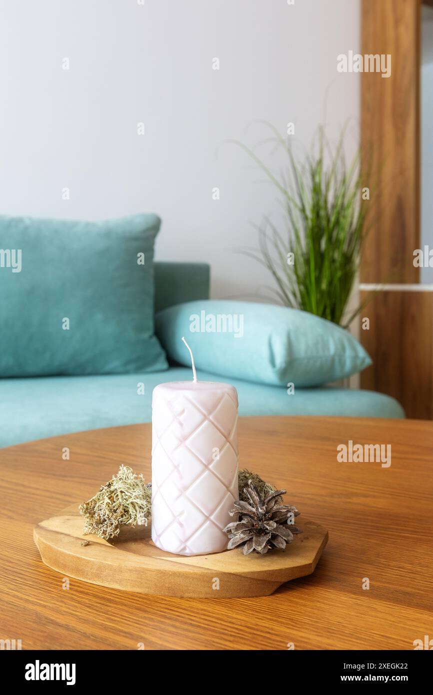 Cozy corner of living room with candle and sofa Stock Photo - Alamy