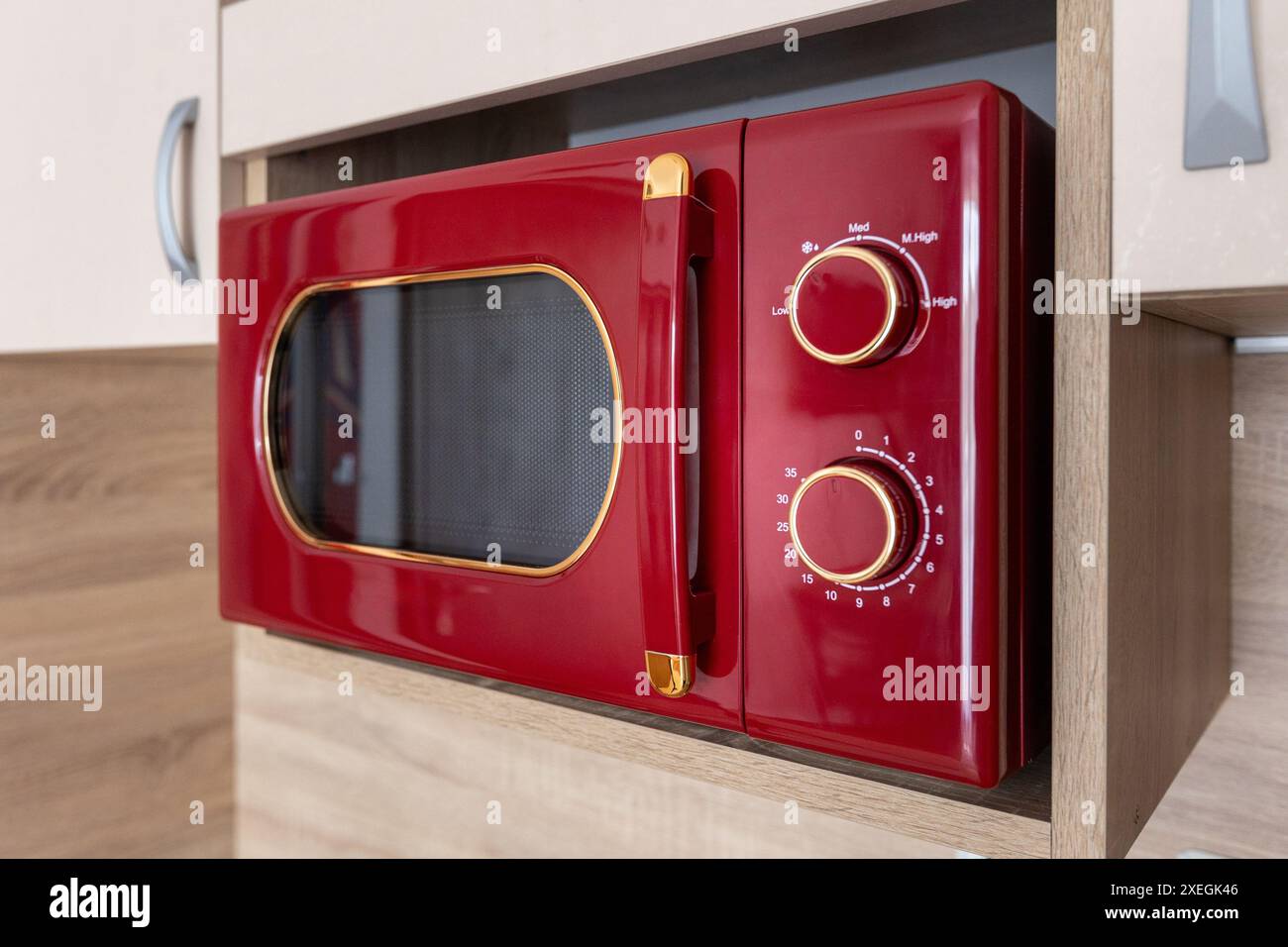 Modern red microwave oven Stock Photo - Alamy