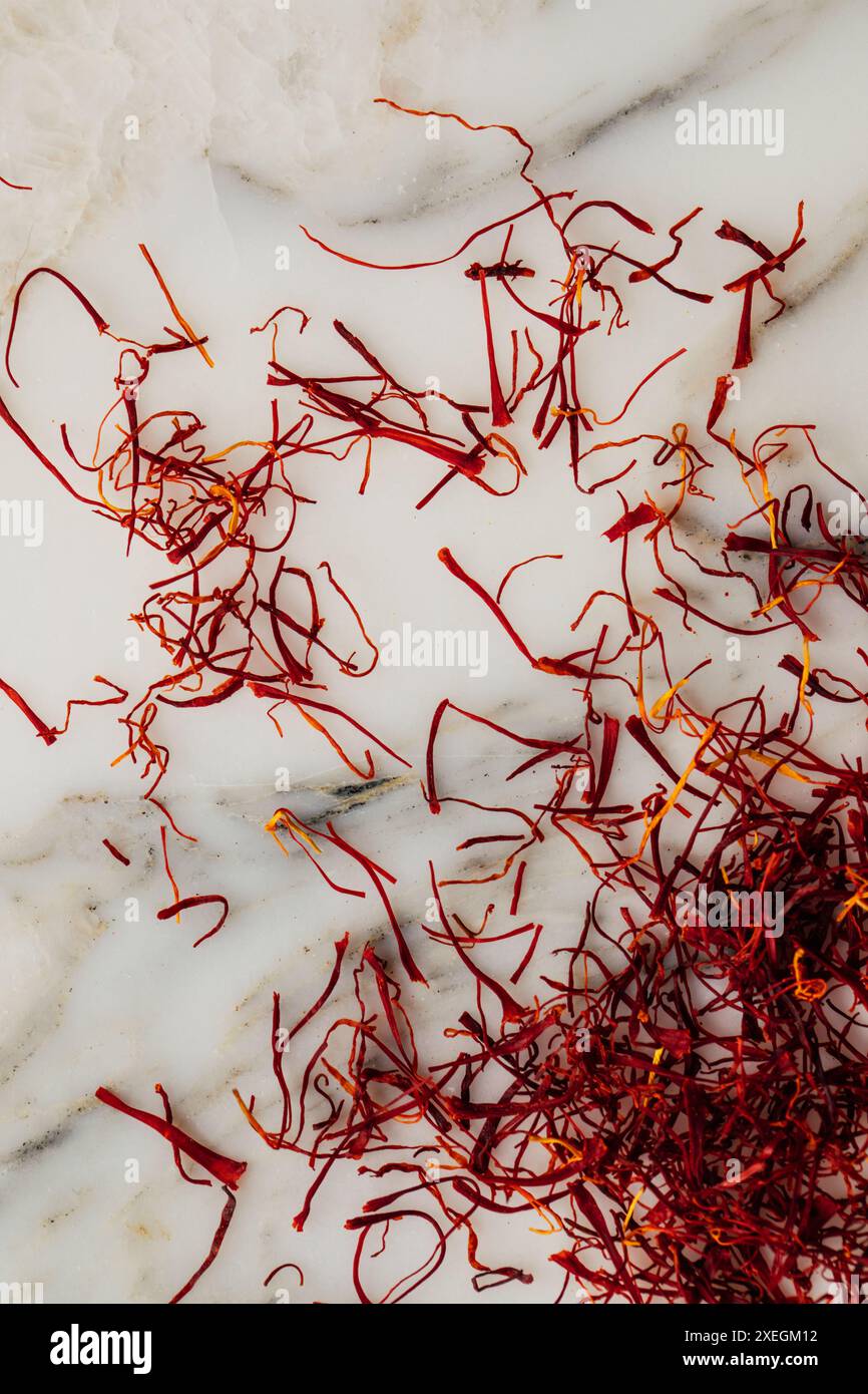 red saffron threads on white marble surface Stock Photo - Alamy