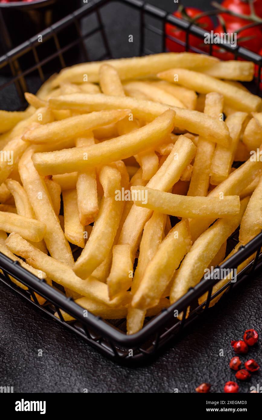 Fresh delicious crispy French fries with salt and spices Stock Photo ...